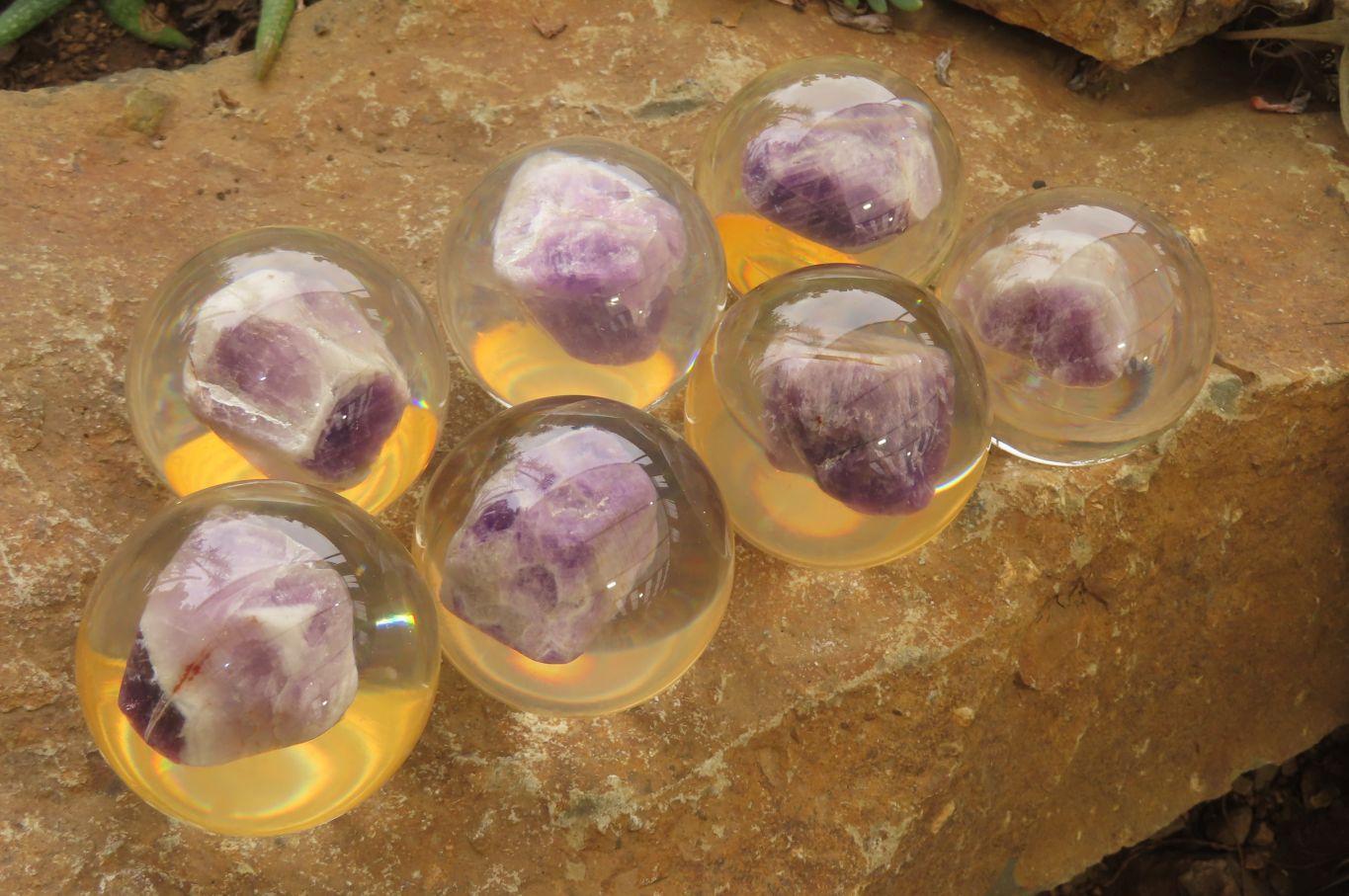 Polished Chevron Amethyst cobbed pieces in PVC Resin Paperweight Spher ...