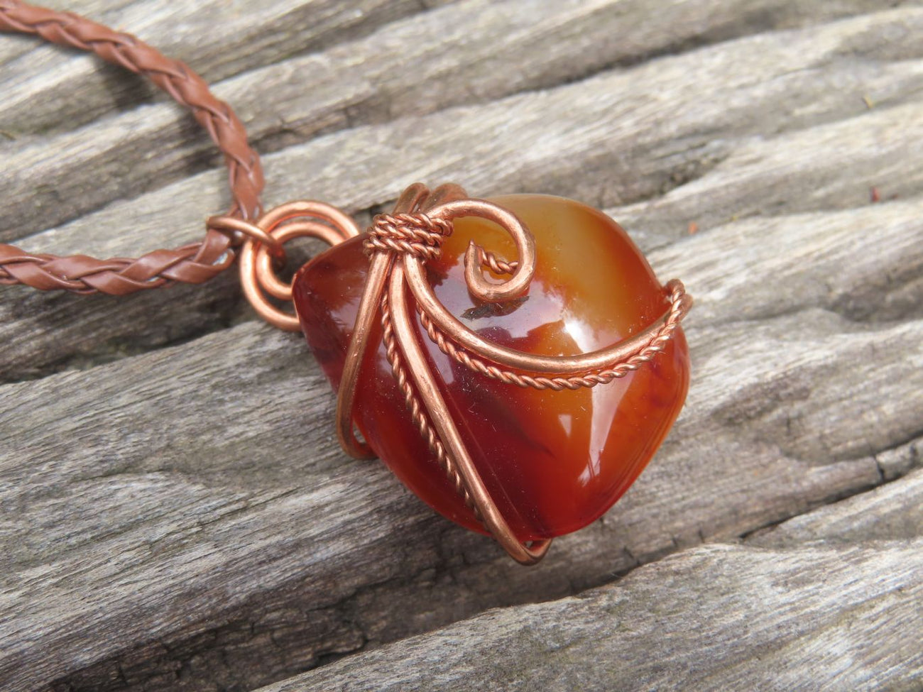 Polished Selected Carnelian Jewellery Free Forms set with Wire Wrap Copper Art Pendant braided Thong Sold per Piece From Madagascar Toprock Gemstones and Minerals